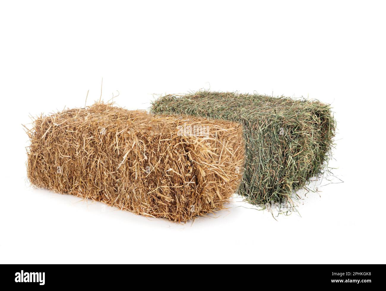 bundles of straw and hay in front of white background Stock Photo - Alamy