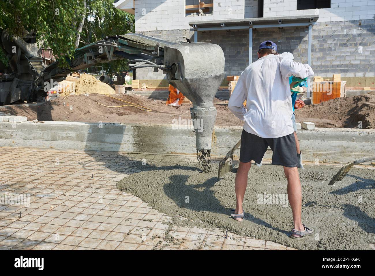 Construction worker in the concrete at the construction site during ...