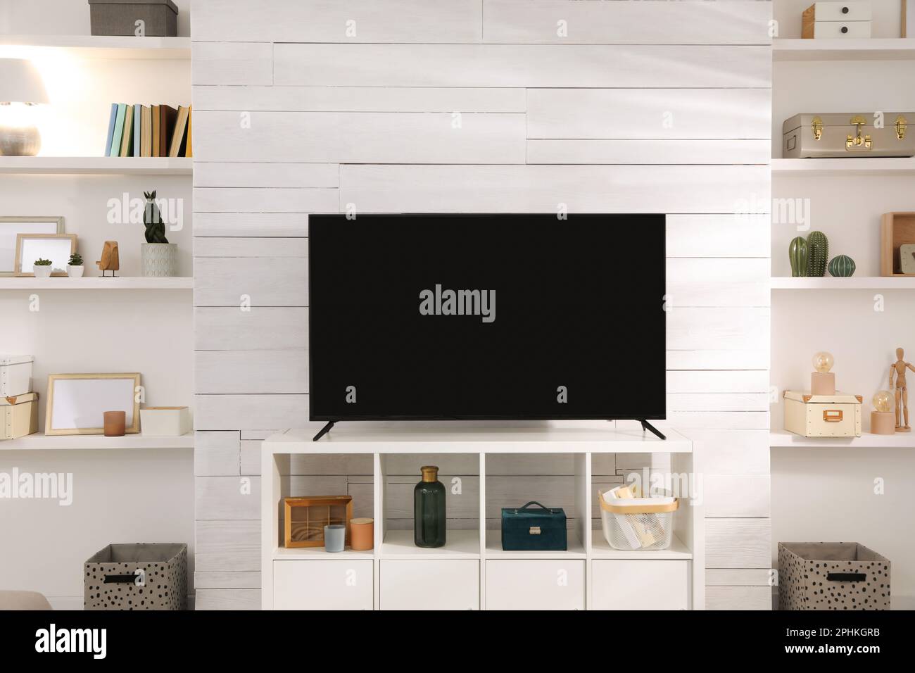 Cozy room interior with stylish decor and modern TV set Stock Photo - Alamy