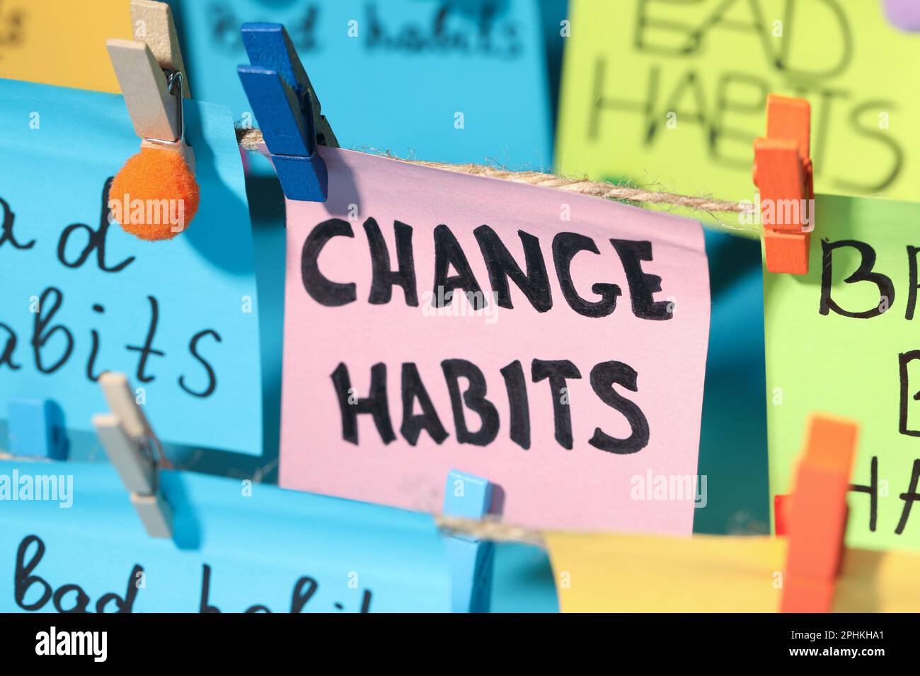 Different paper notes hanging on ropes, closeup. Change Habits Stock ...