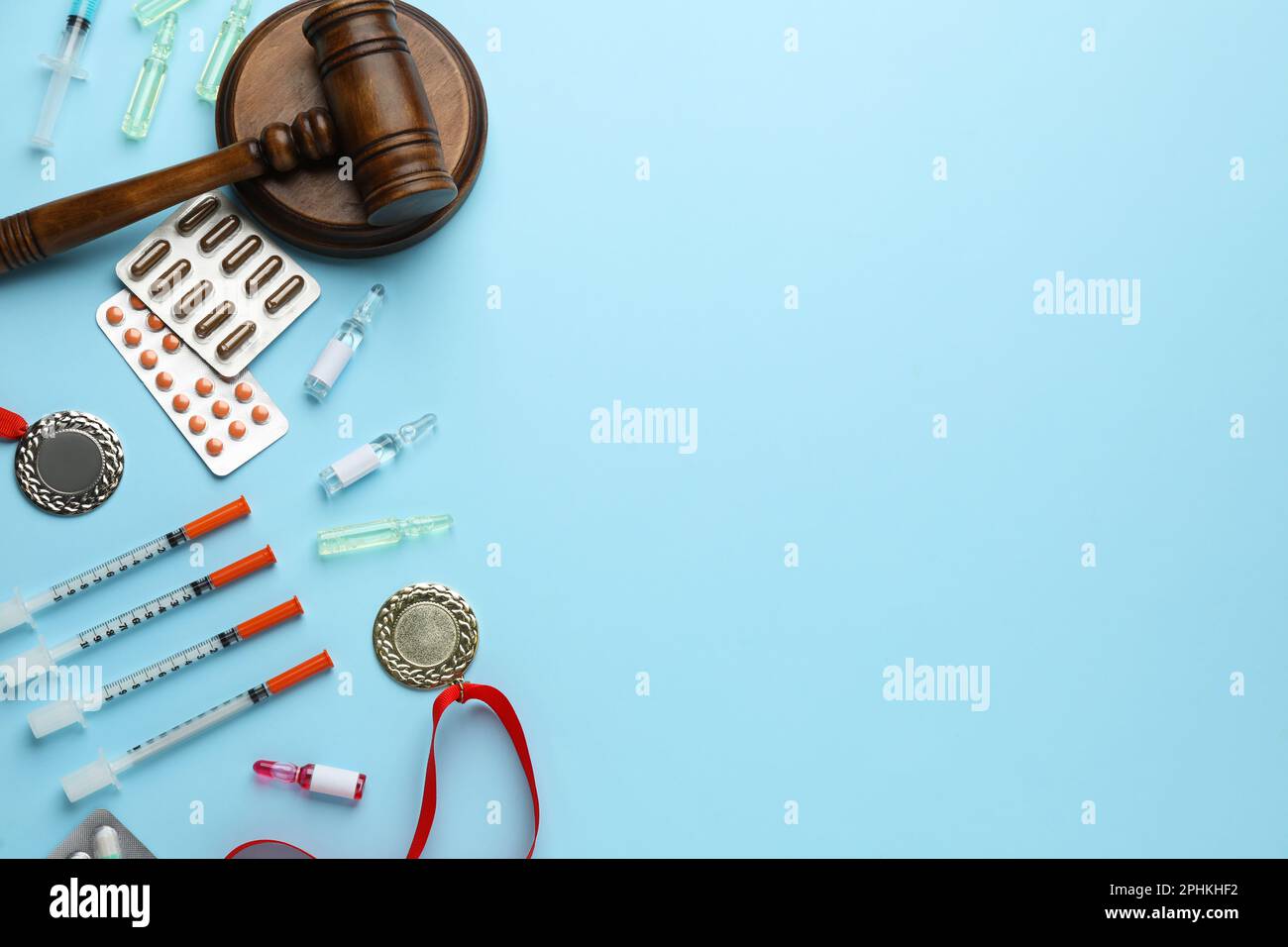 Flat lay composition with drugs on light blue background, space for ...