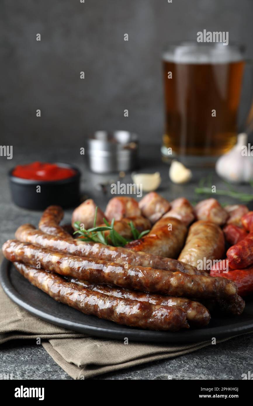 Set of different tasty snacks on dark grey table, closeup Stock Photo ...