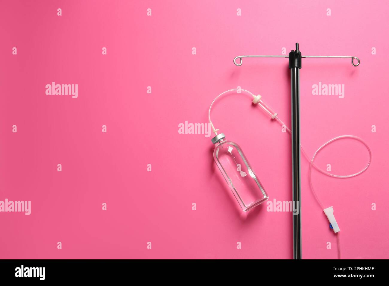 IV infusion set on pink background, flat lay. Space for text Stock ...