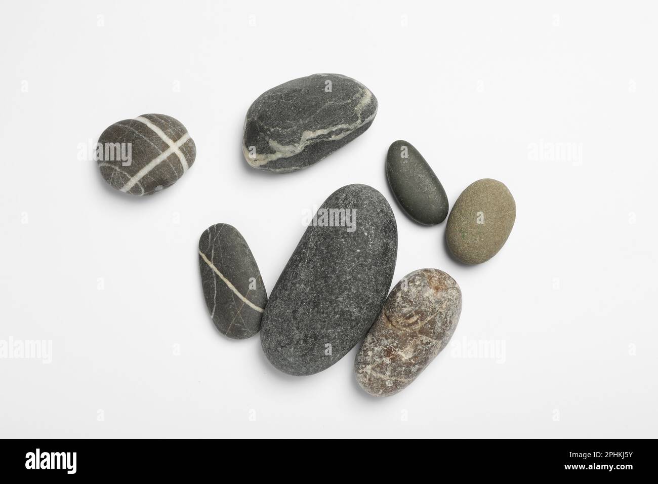 Many different stones on white background, top view Stock Photo - Alamy