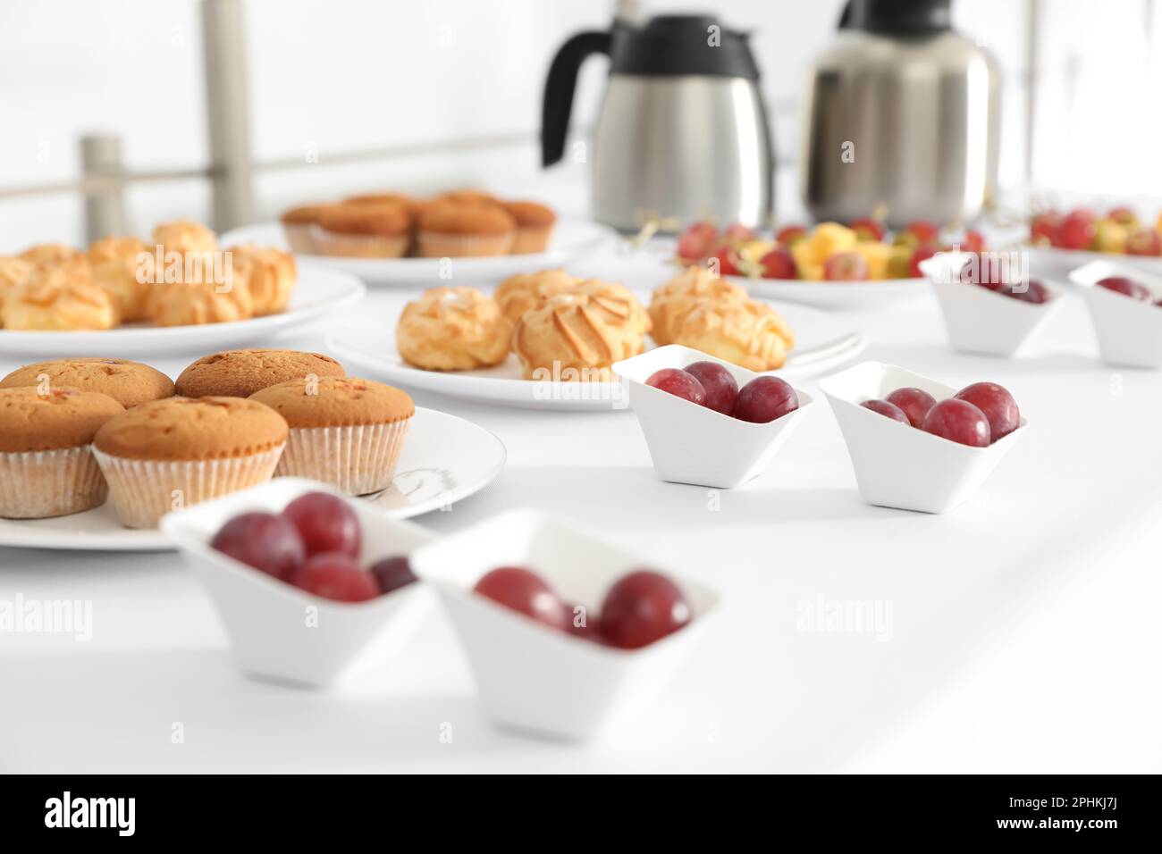 Table with different delicious snacks indoors. Coffee break Stock Photo ...