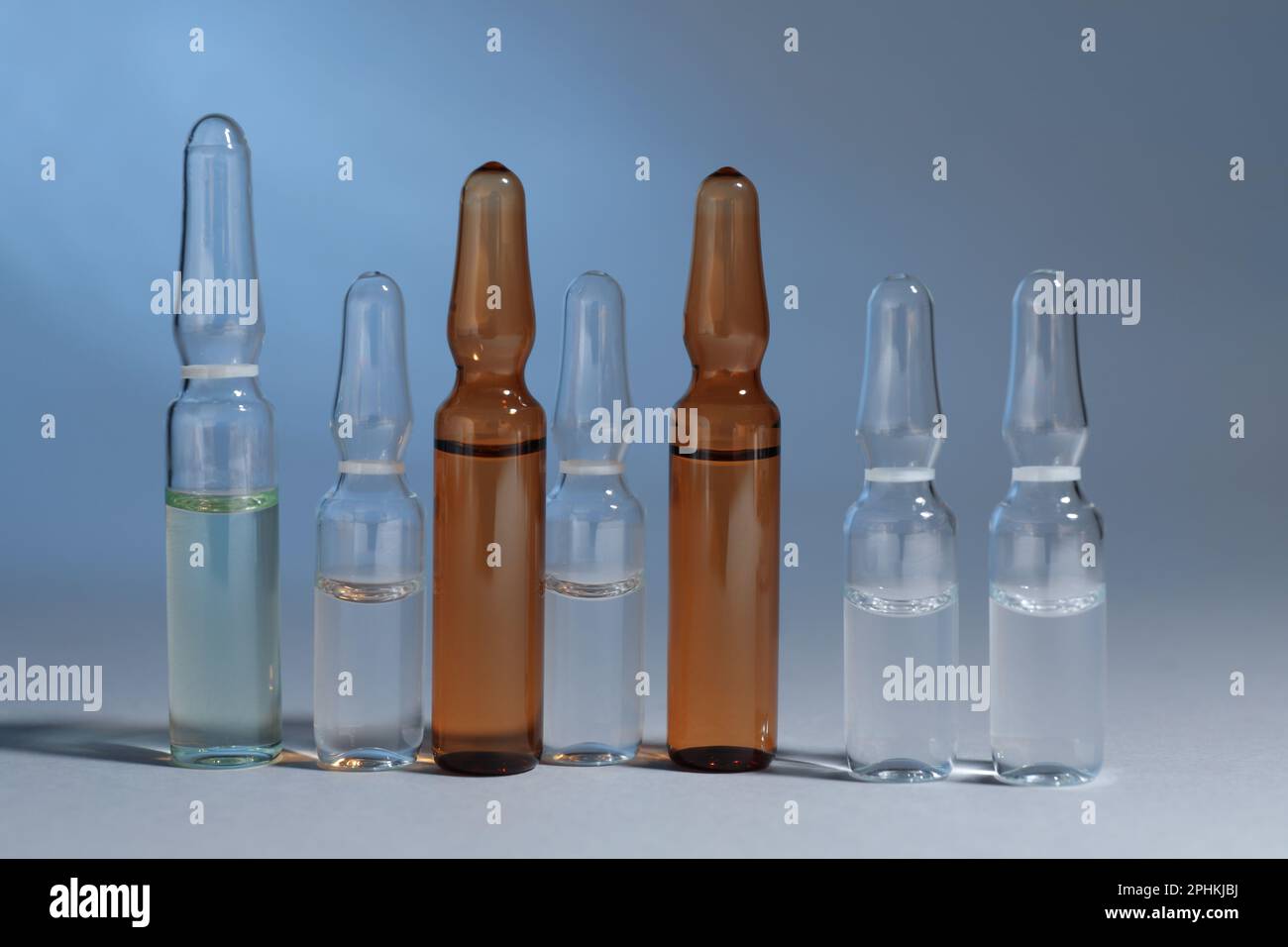 Different pharmaceutical ampoules on light grey background Stock Photo ...
