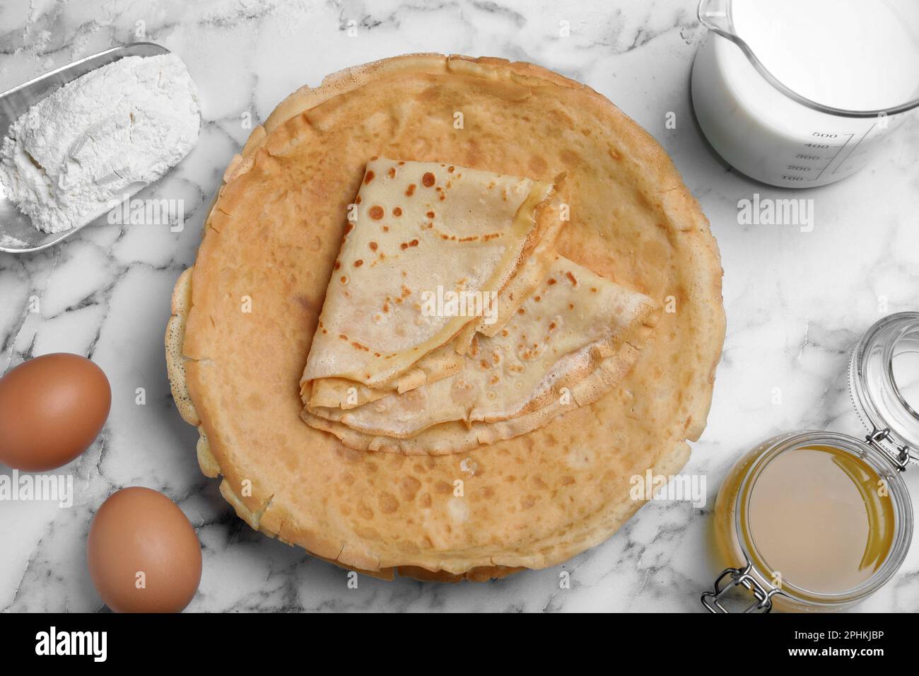 Delicious crepes and ingredients on white marble table, flat lay Stock ...
