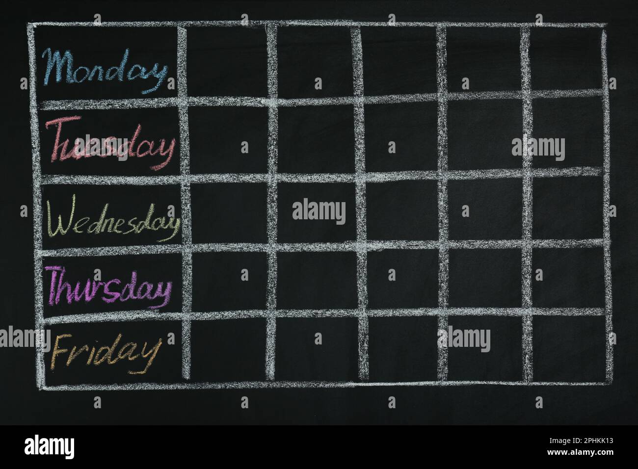 Weekly school timetable drawn on black chalkboard Stock Photo - Alamy