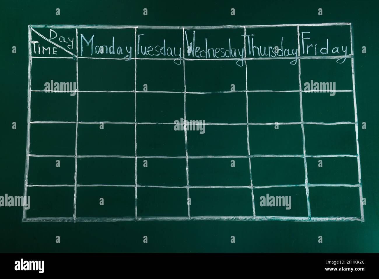 Weekly school timetable drawn on green chalkboard Stock Photo - Alamy
