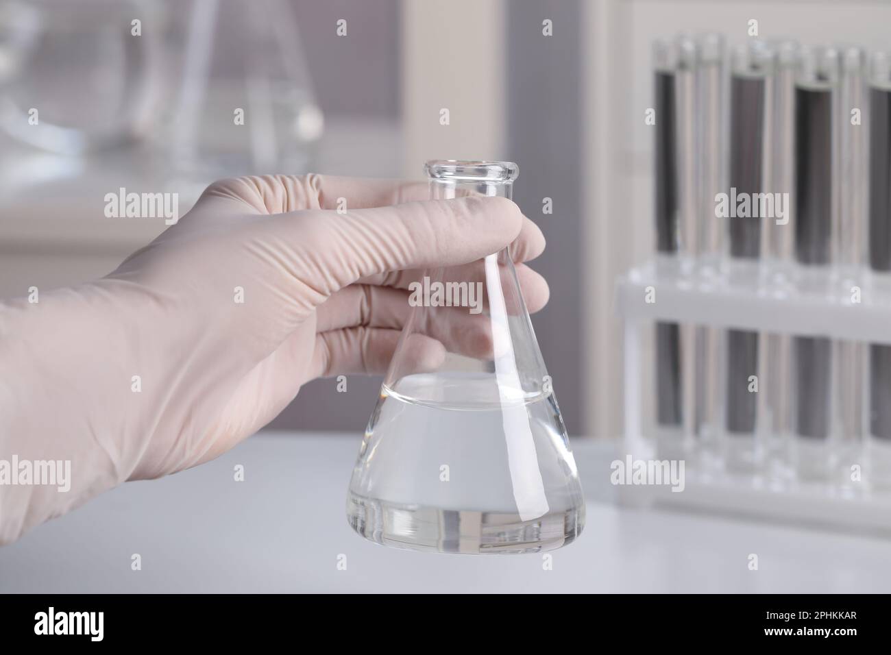 Scientist holding glass water in hi-res stock photography and images ...