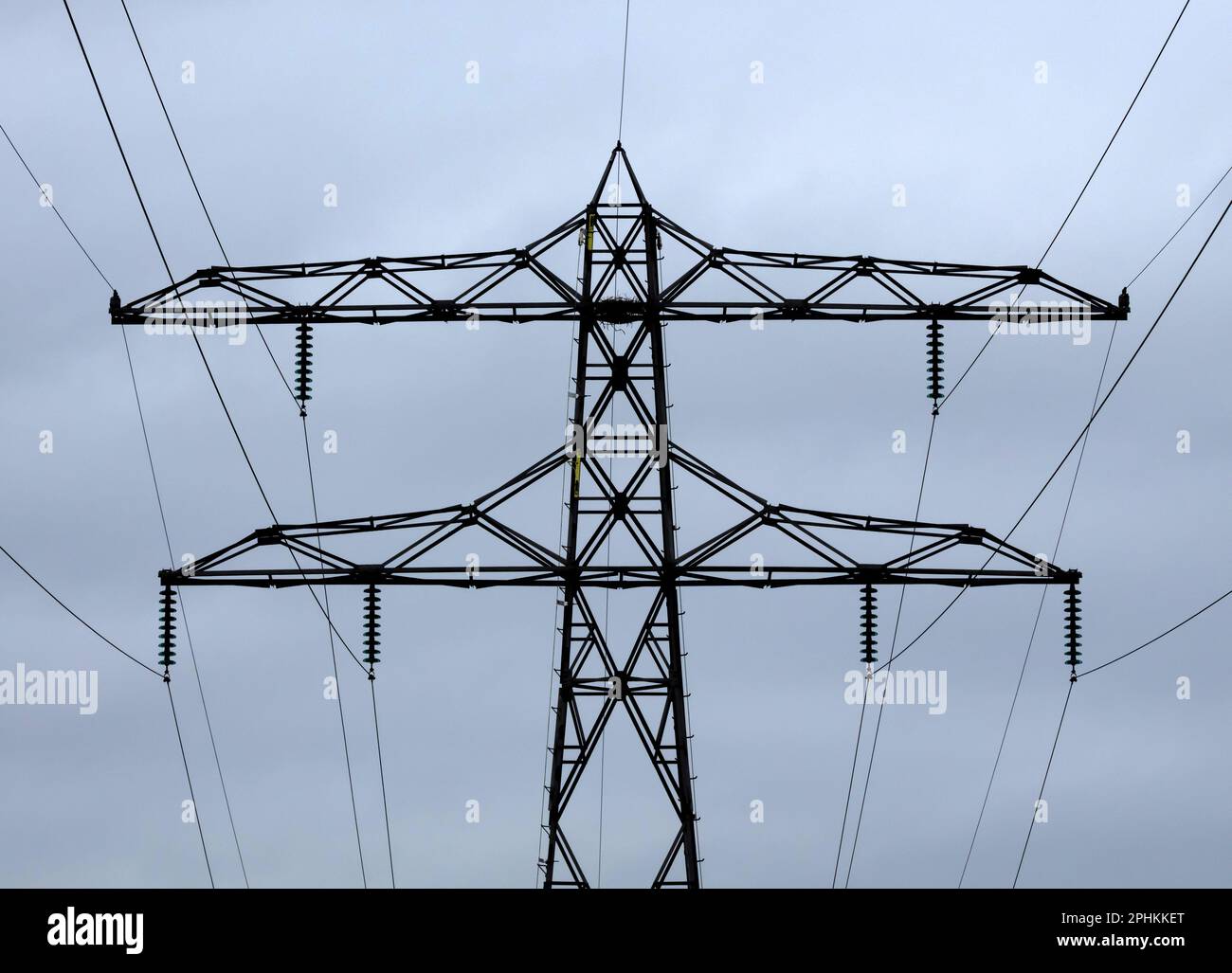 Interesting angle of an electricity pylon, showing wires and insulator ...
