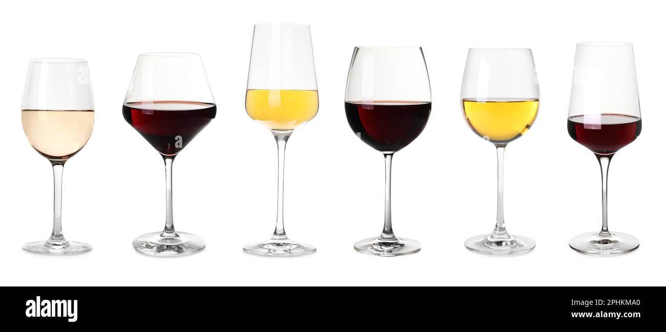 Set with glasses of different delicious expensive wines on white ...