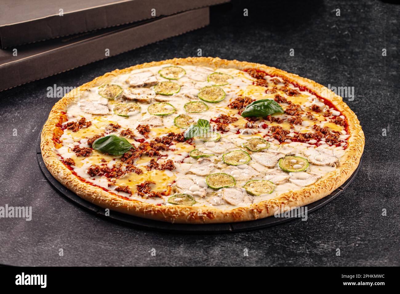Big assorted pizza with variety of toppings Stock Photo - Alamy
