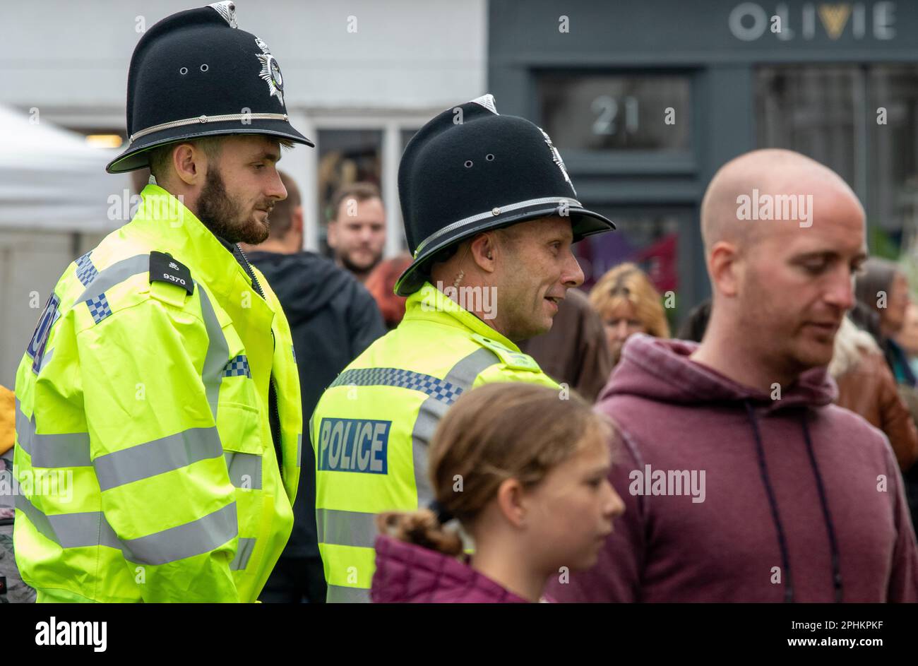 Two police officers (one a special) meet and greet whilst patrolling at ...