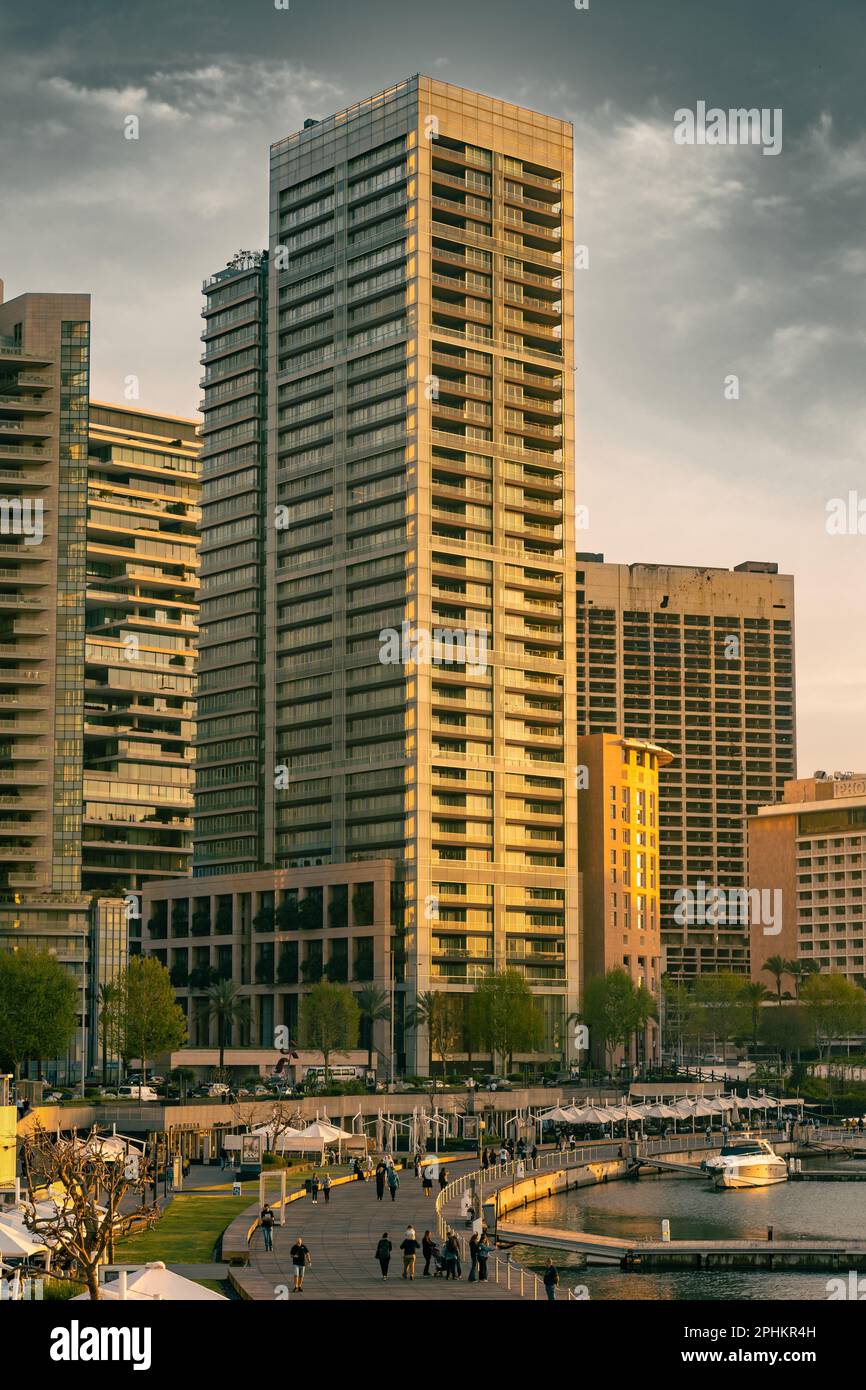 A scenic view of a bustling city skyline seen from the opposite bank of ...