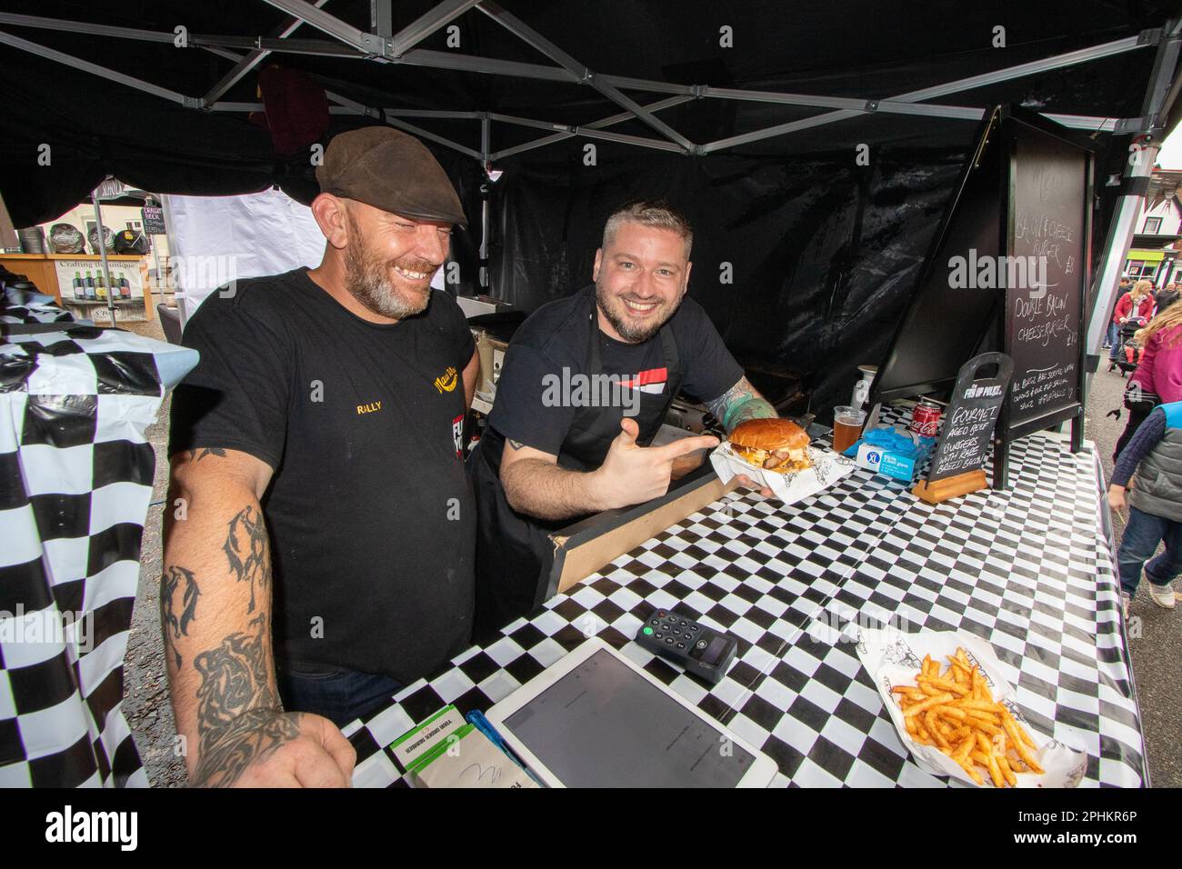 Happy smiling vendors of posh burgers at the Framlingham sausage ...