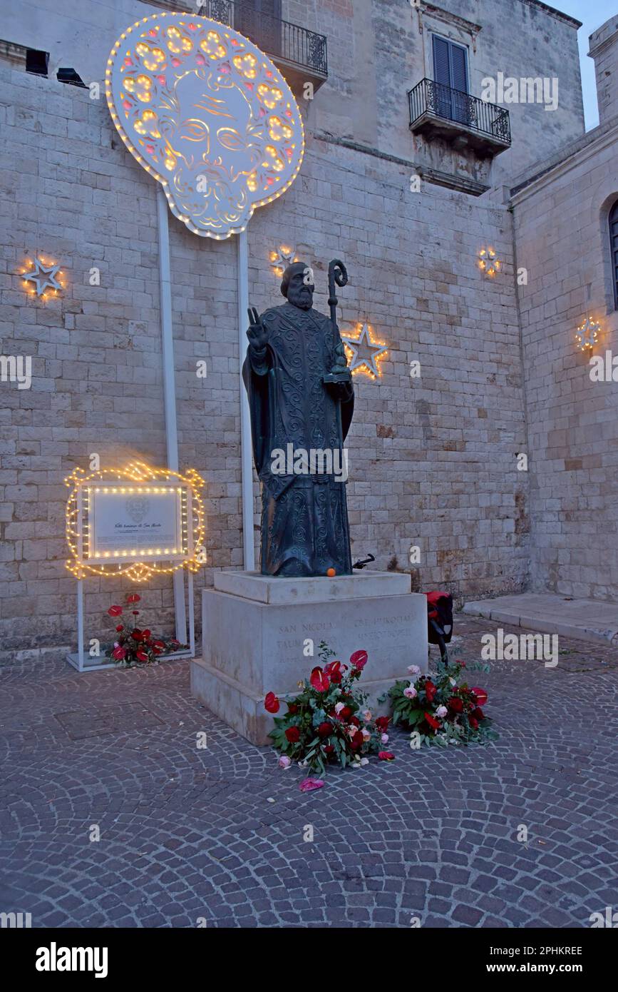 Statue figure of Saint Nicholas with Christmas lights & decorations ion ...
