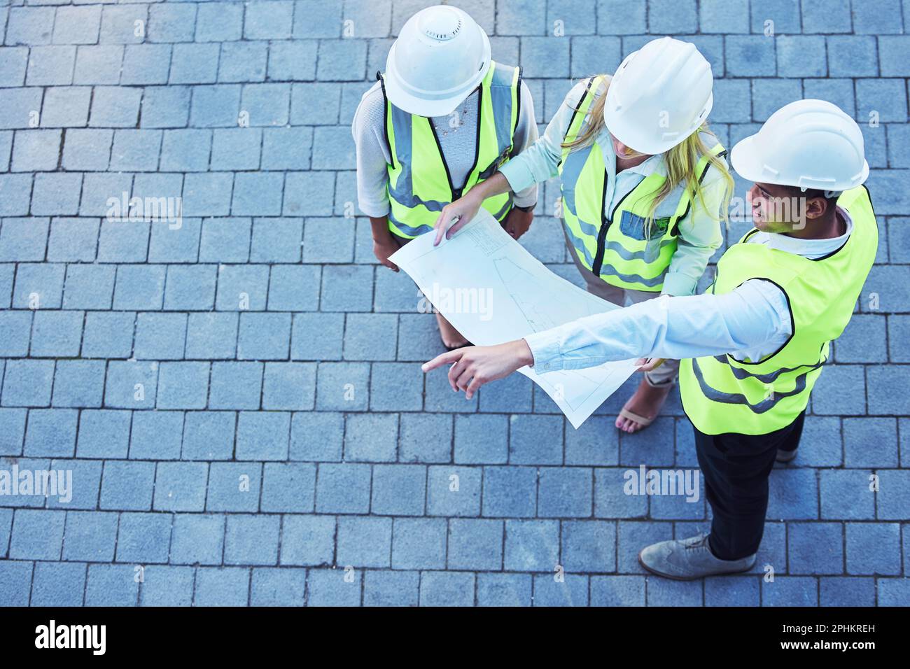 Top view, team and blueprints for engineering, discussion and ...