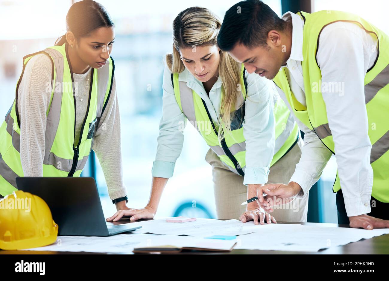 Architect, team and meeting in blueprint planning for construction ...