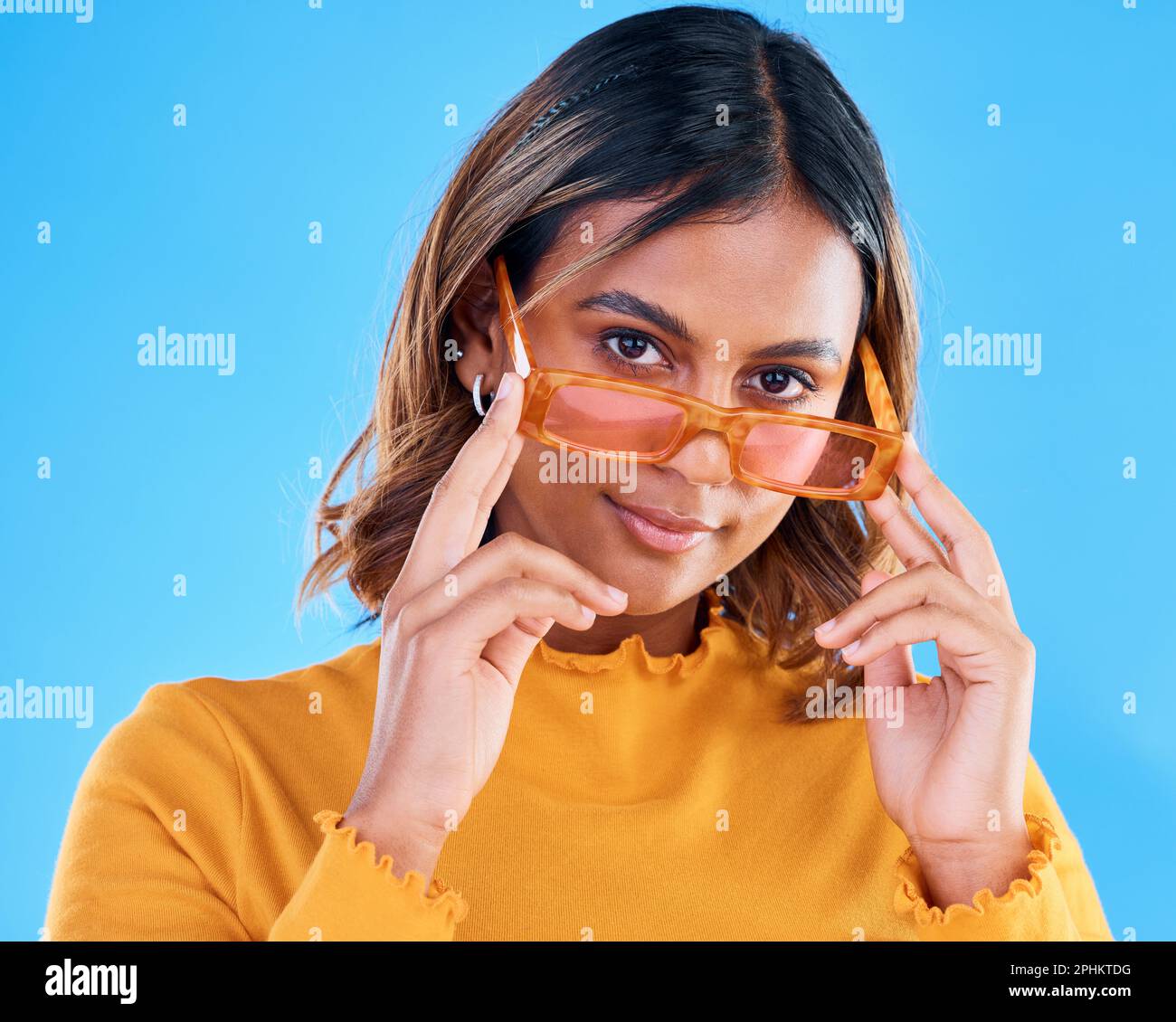 Fashion, portrait and studio woman with sunglasses, designer brand ...