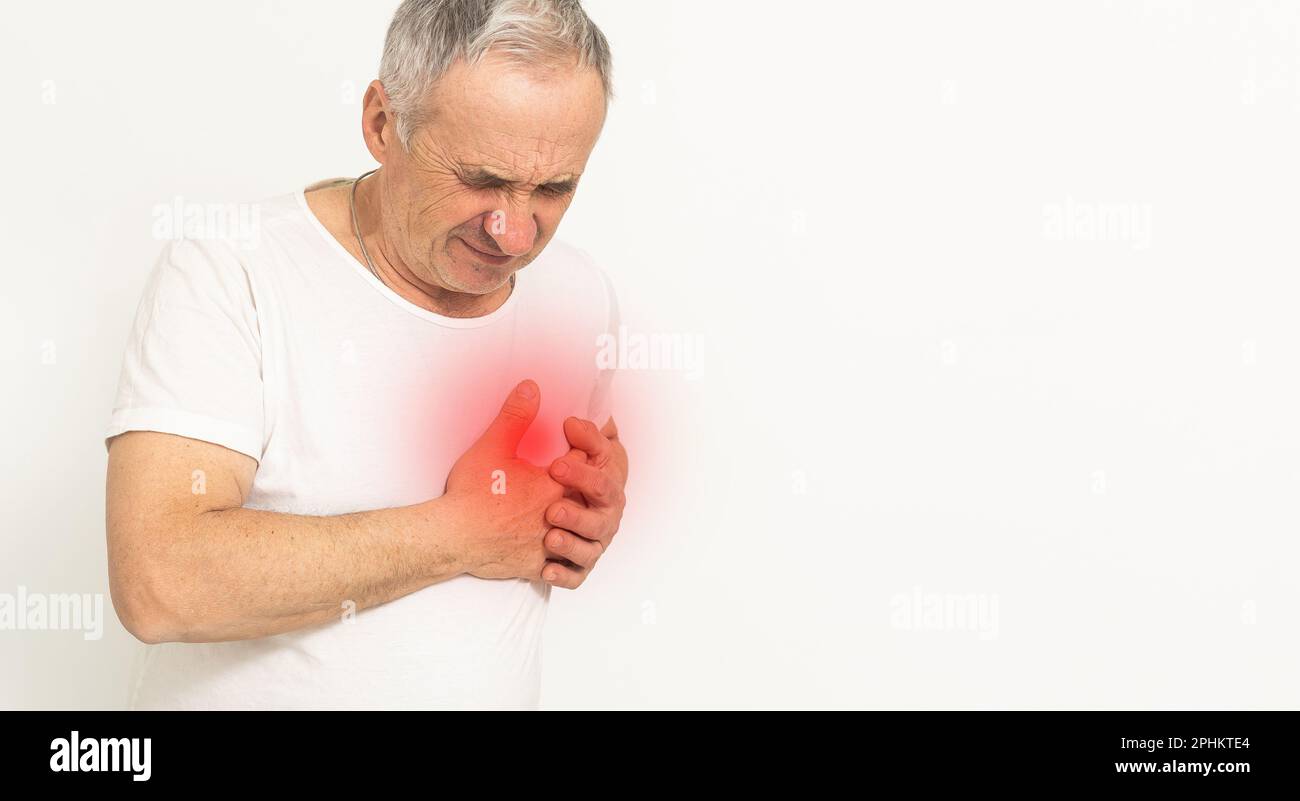 Good looking old man having chest pain heart attack or cardiac arrest ...