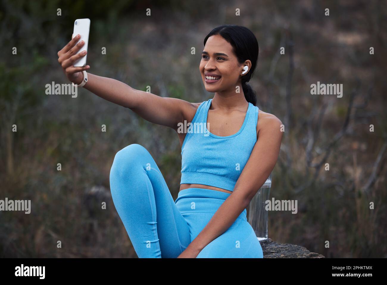 Woman outdoor, runner and fitness selfie, smile with earphones and ...