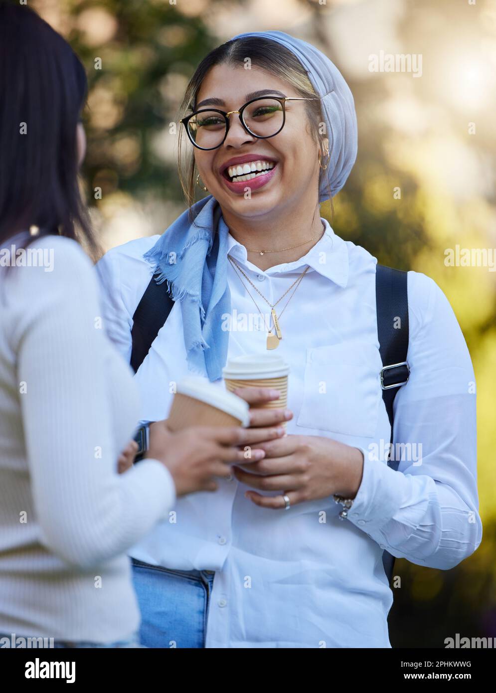 Laughing, break or university friends at park on campus for learning ...