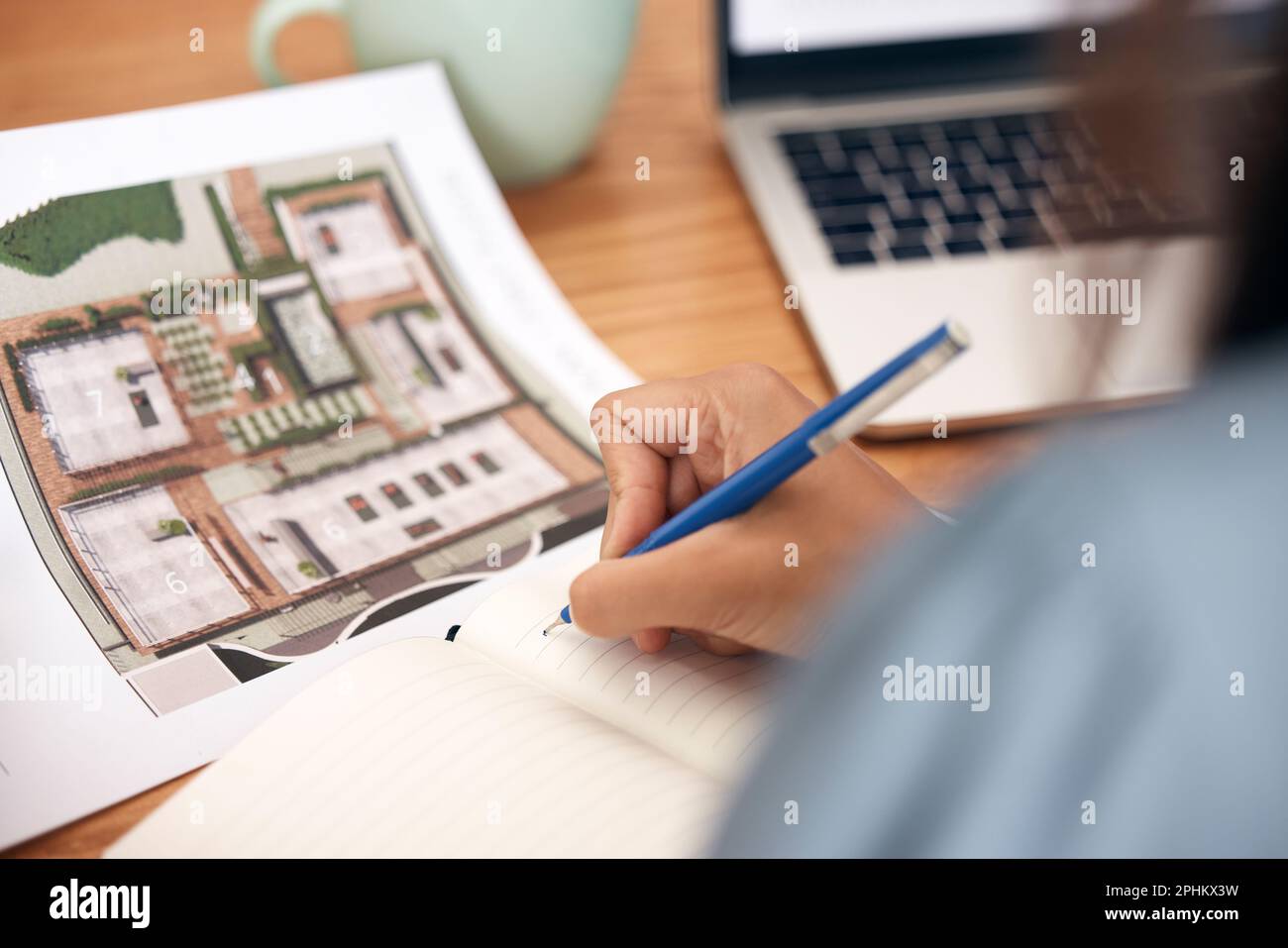 Architecture blueprint, notebook hands writing and woman working on ...