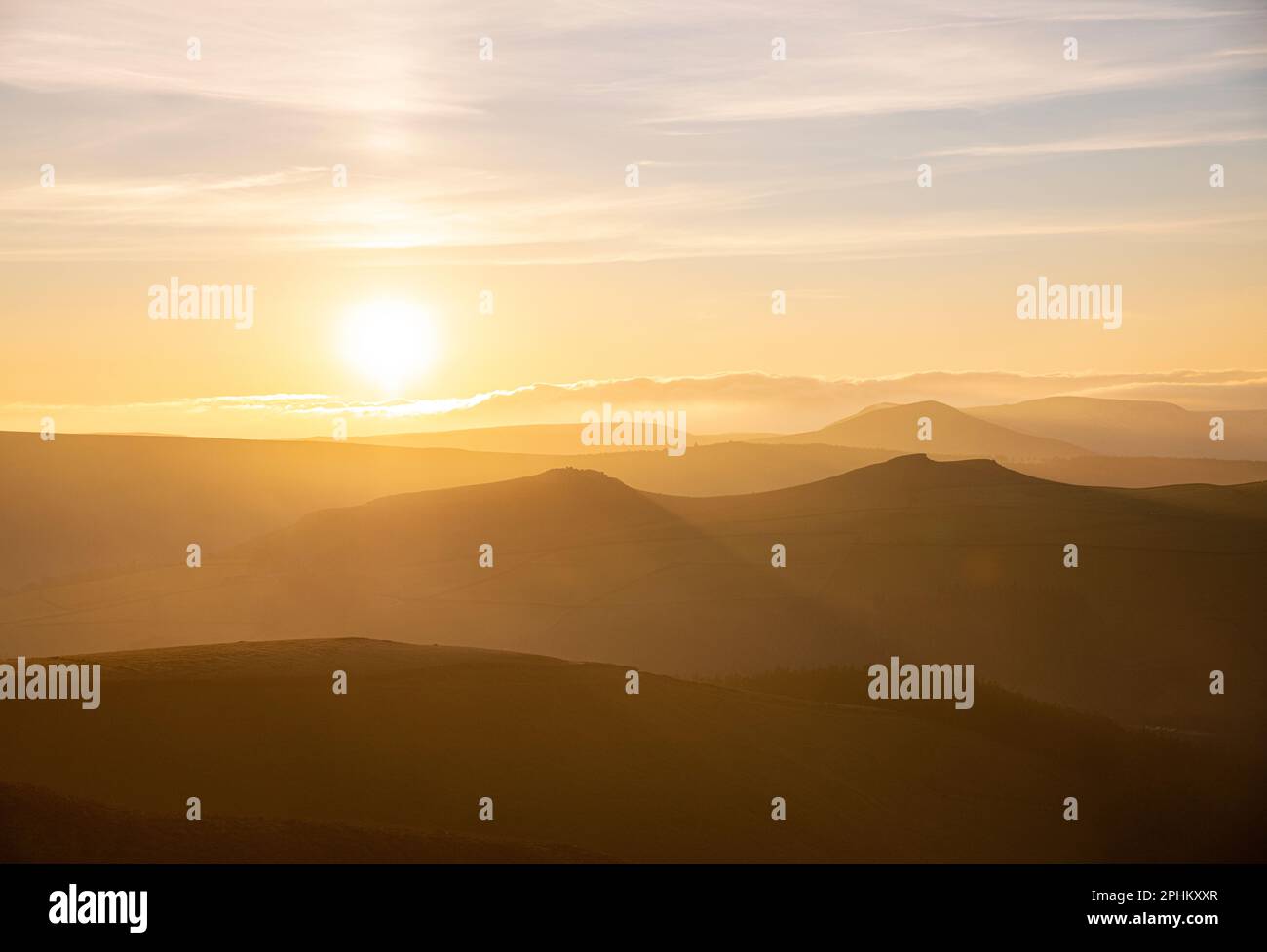 Sunset over the hills of the Dark Peak area of the English Peak ...