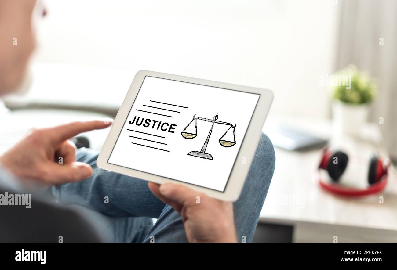 Tablet screen displaying a justice concept Stock Photo - Alamy