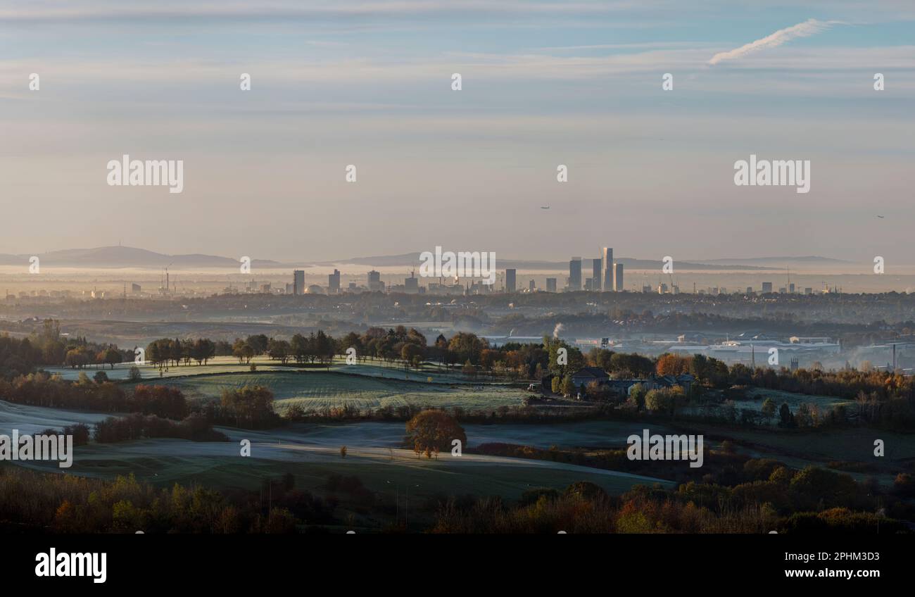 Distant towers of Manchester on a frosty winters morning with a bit of ...