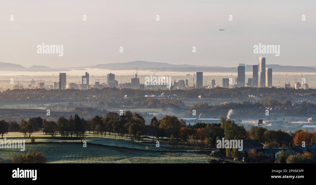 Distant towers of Manchester on a frosty winters morning with a bit of ...
