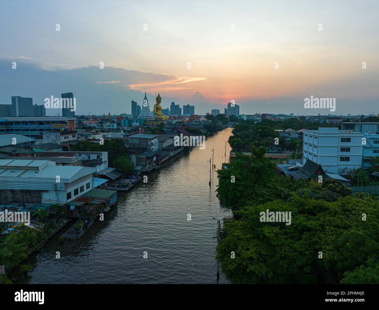 aerial view golden big Buddha Wat Paknam Phasi Charoen in sunset ...
