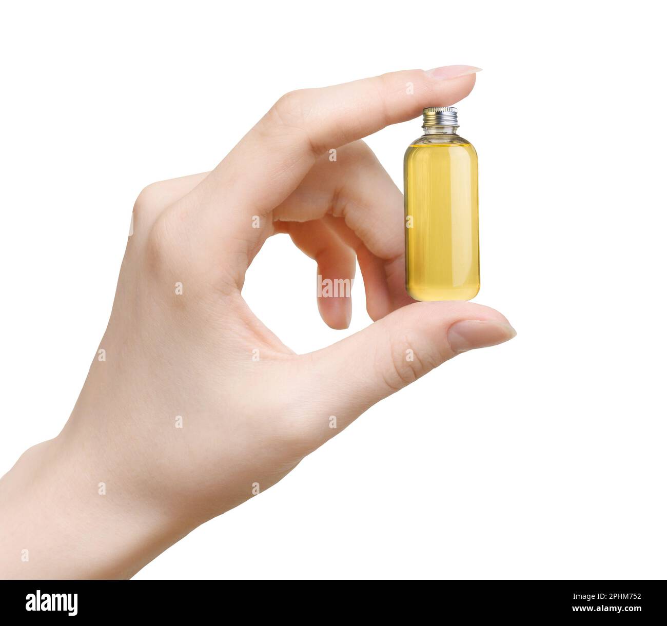 Bottle of essential oil in woman's hand isolated on white background ...