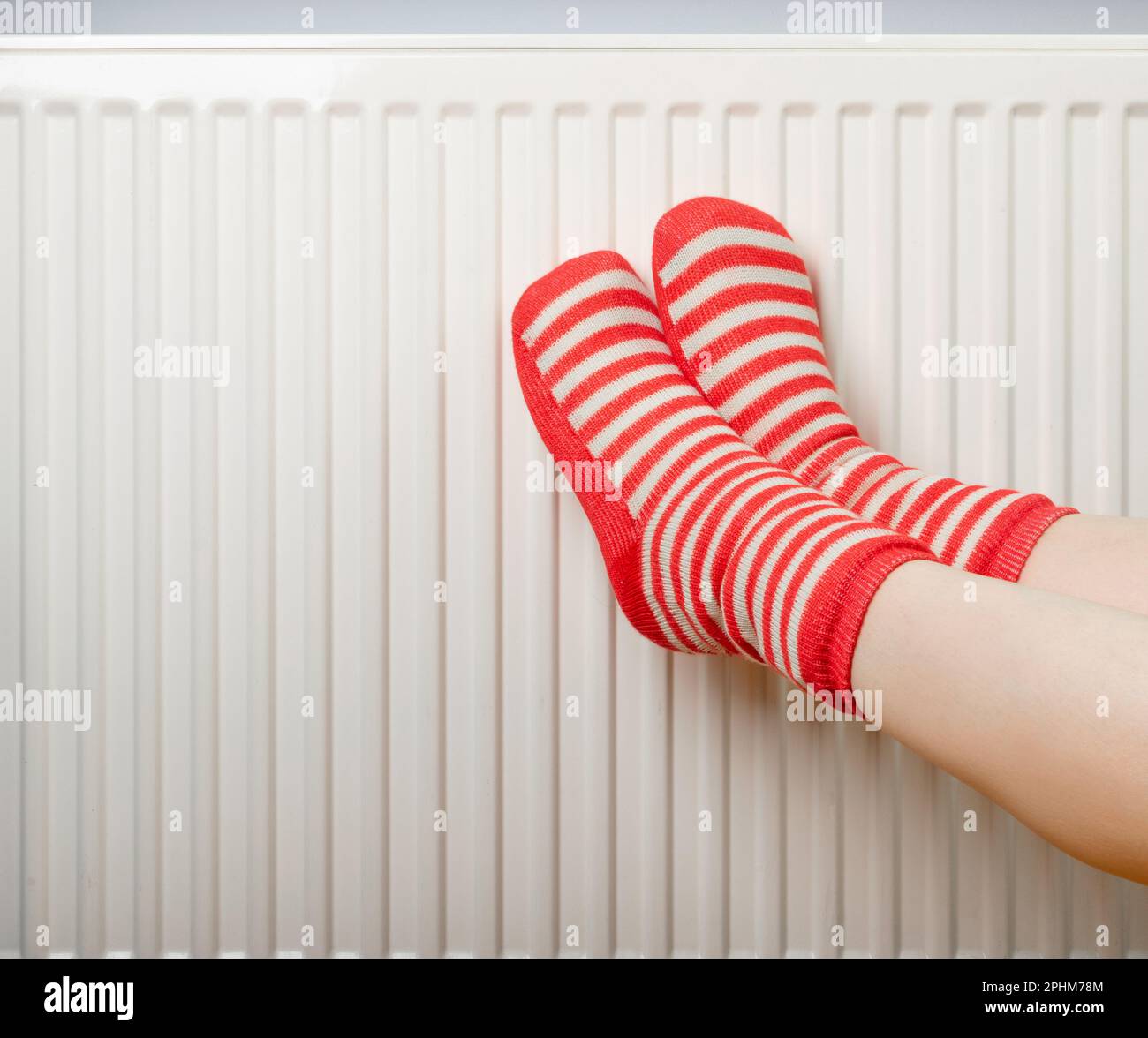 Warming Feet on White Radiator, Man Warms his Feet at Home, Cold Winter ...