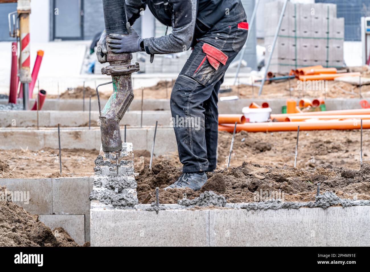 concreting from the pipe of the foundation of the building from the ...