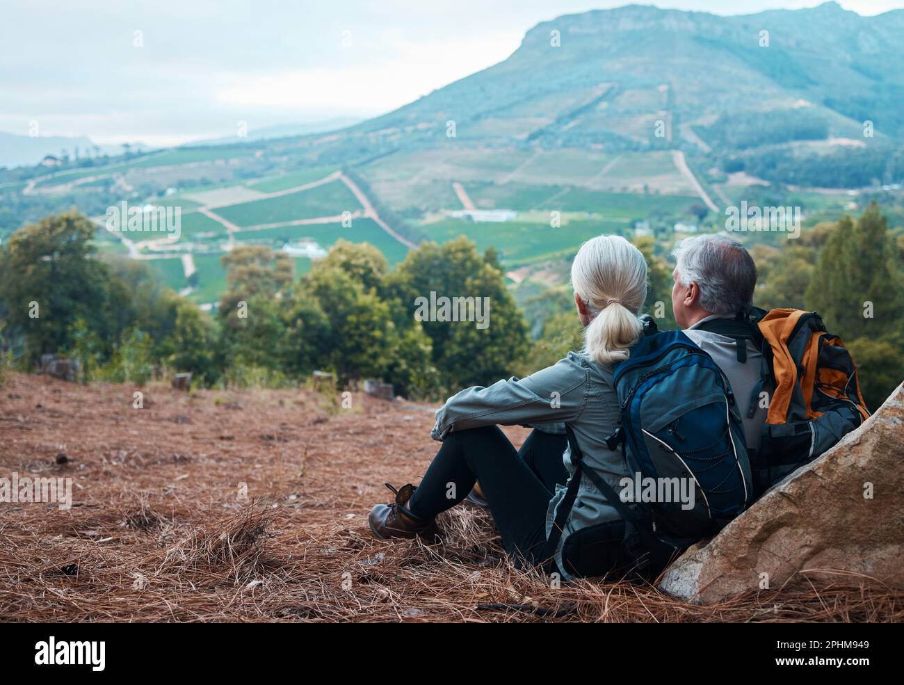 Retirement, hiking and old couple with relax with view of hill from ...