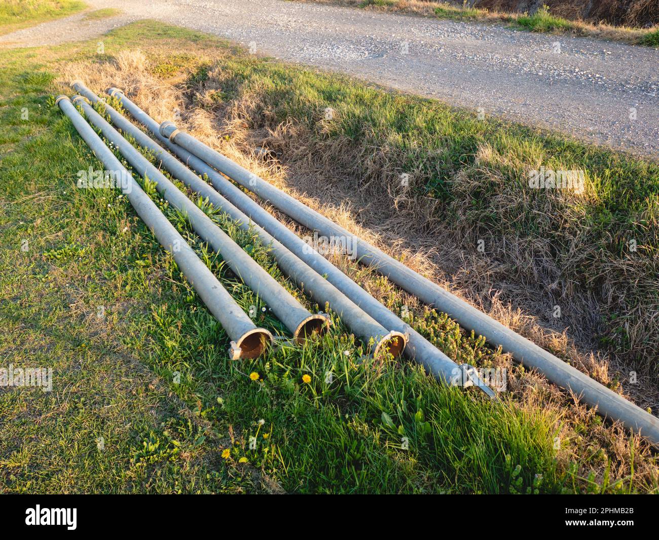 pipes near a canal, in ground while Installing a sprinkler system due ...