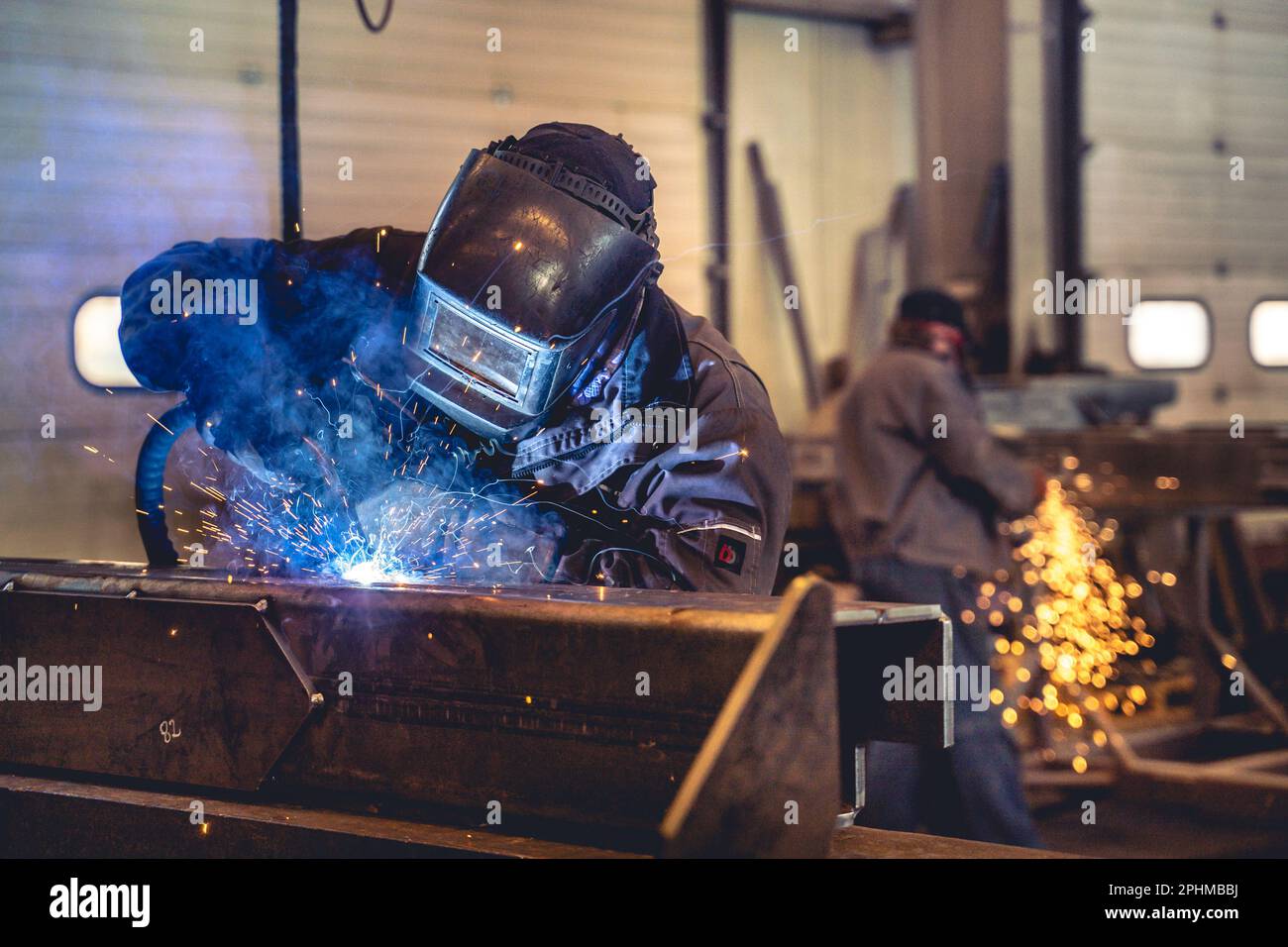 Skilled mechanic using welding machine hi-res stock photography and ...