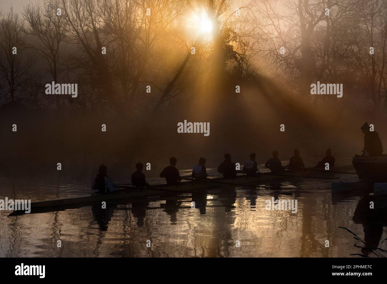 A misty and startlingly beautiful winter sunrise bursts out from behind ...