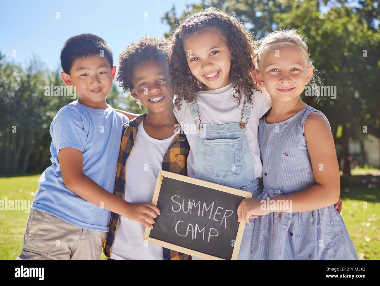 Summer camp, portrait or kids hugging in park together for fun, bonding ...