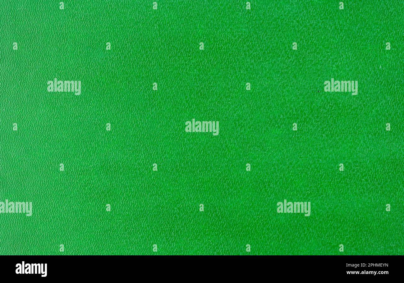 Rough bright hard green cardboard, sheet as texture, background or ...