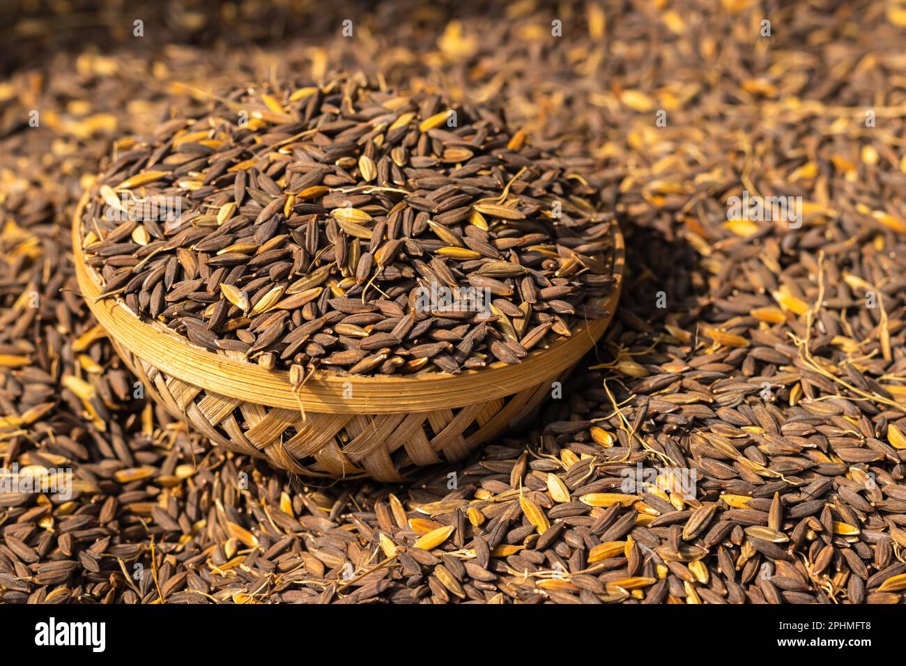 black paddy rice seeds in bamboo bowl from top angle at day Stock Photo ...