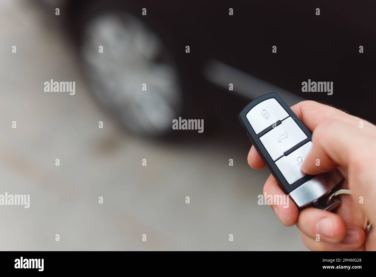 ?and Presses button on the remote key to open central locking car doors ...