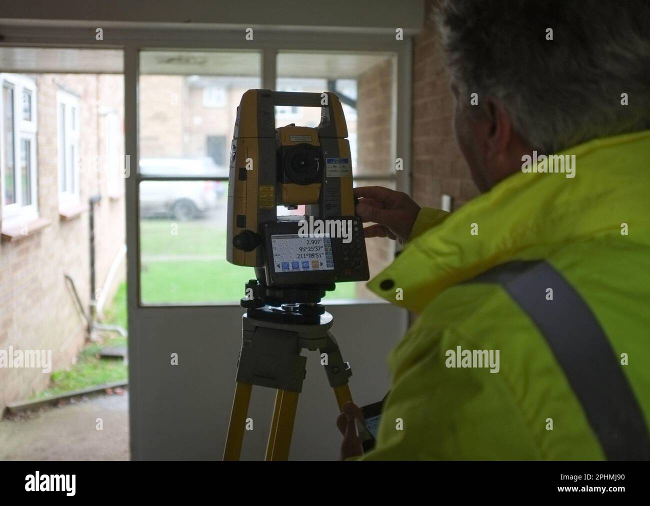 A Land Surveyor carries out his work with a Total Station or Theodolite ...