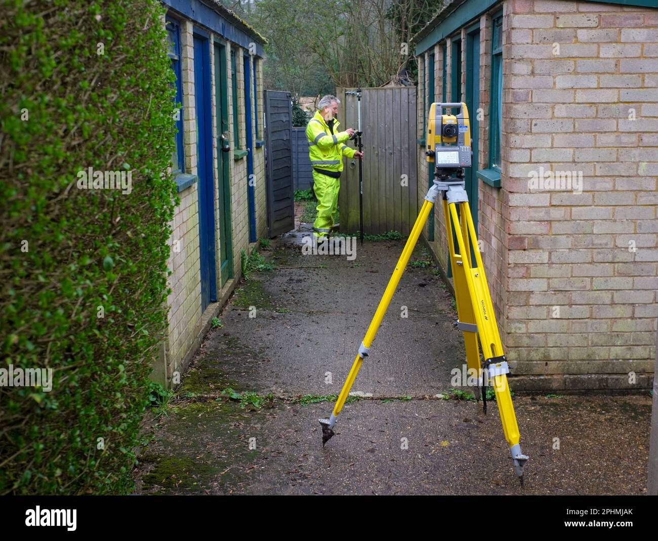 A Land Surveyor carries out his work with a Total Station or Theodolite ...