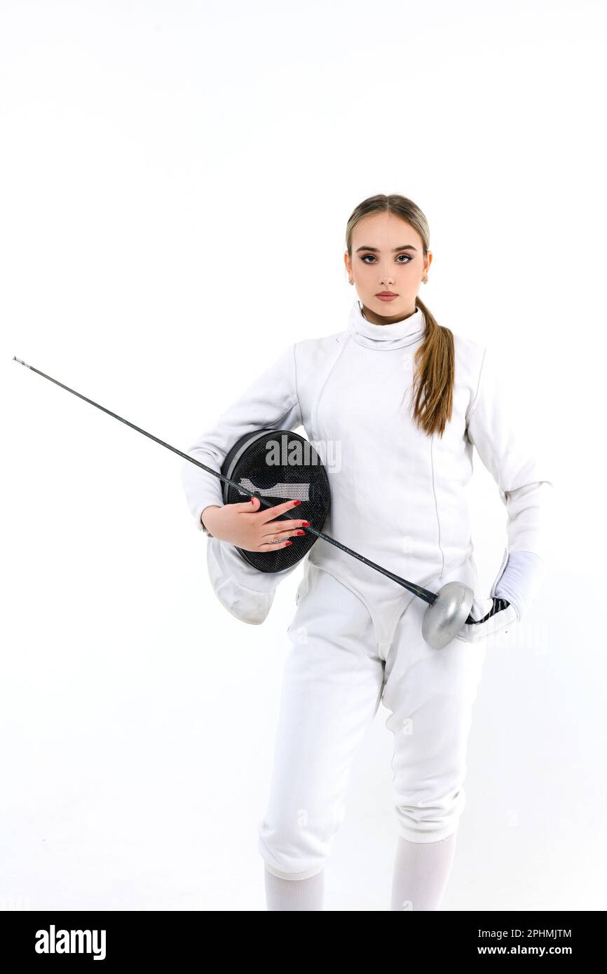 Girl fencer with a sword on a white background. Portrait of a girl in a ...