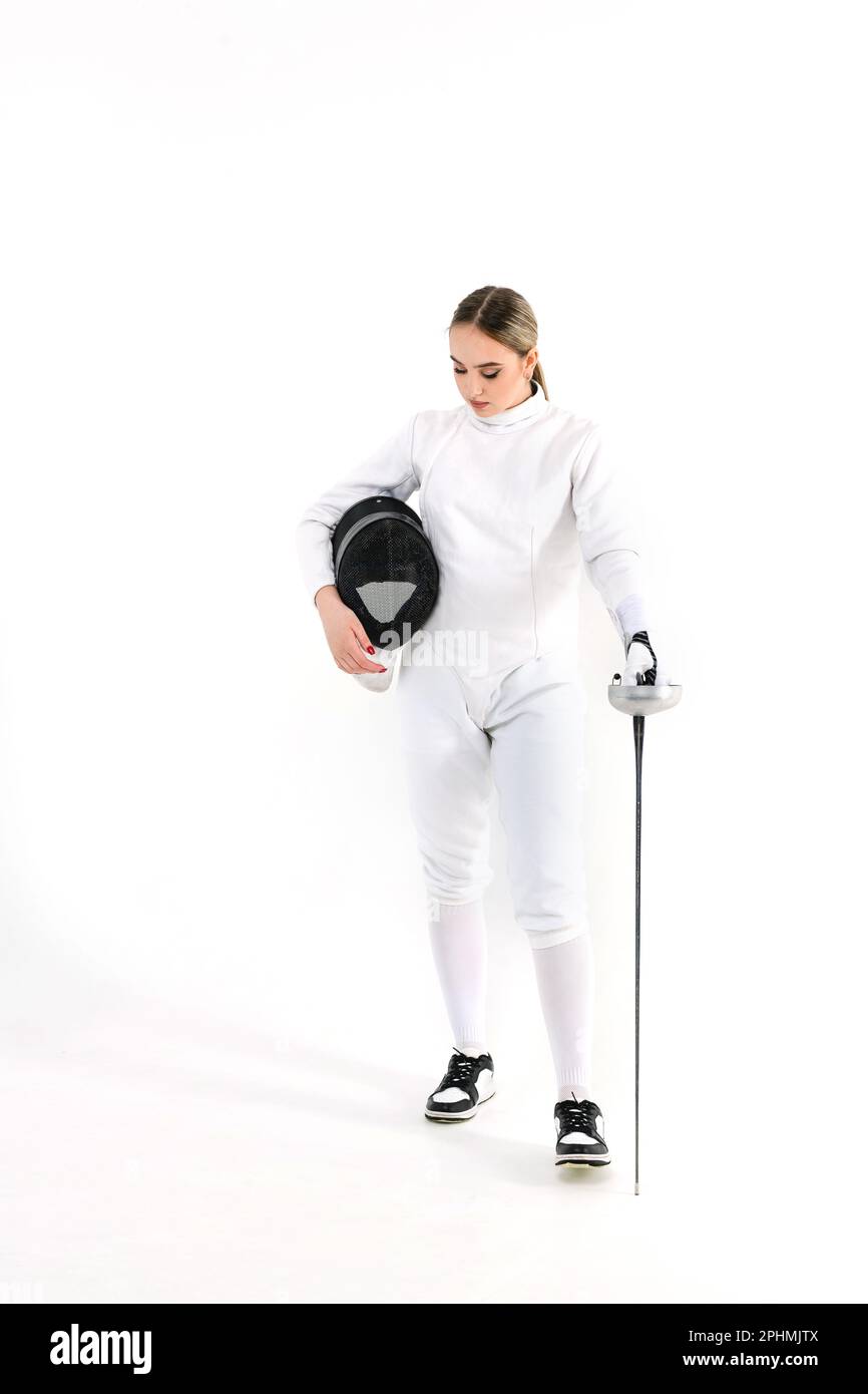 Girl fencer with a sword on a white background. Young female fencer on ...