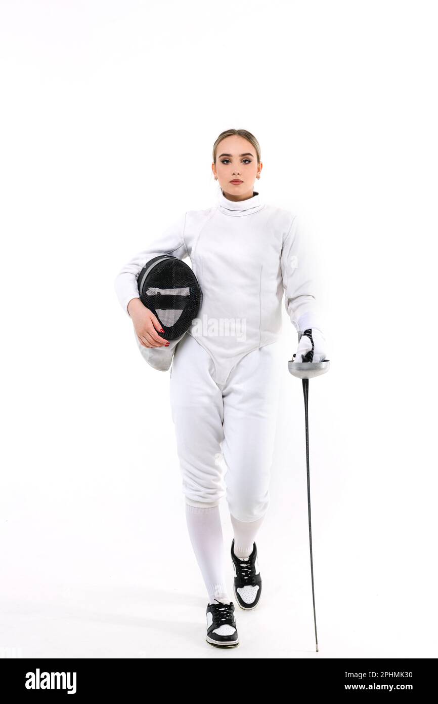 Girl fencer with a sword on a white background. Young female fencer on ...