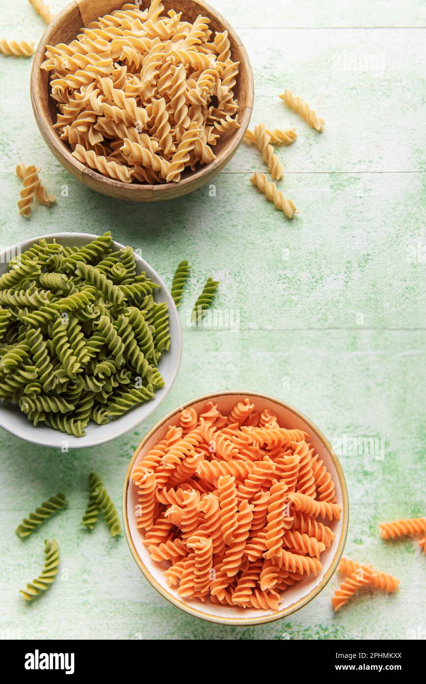 A variety of fusilli pasta made from different types of legumes, green ...